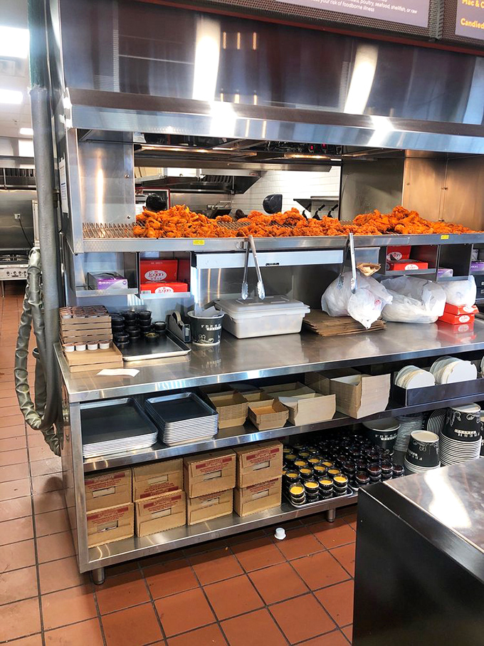 Behind the scenes where the magic happens. Mountains of golden-fried chicken prove they're serious about their signature dish.