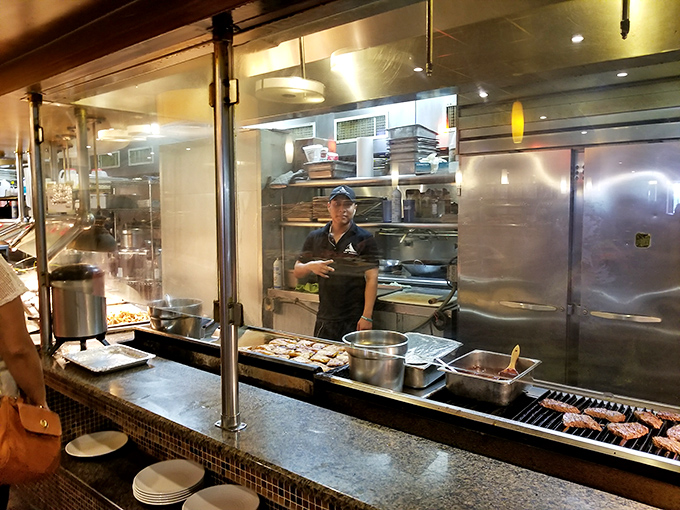 Behind glass walls, chefs orchestrate the endless buffet ballet with practiced precision. These unsung heroes keep your plate-refilling dreams alive.