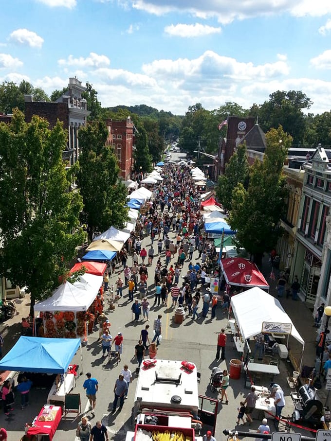 Festival season brings New Harmony's streets to vibrant life, with white tents lining the historic district like pearls on the town's architectural necklace.