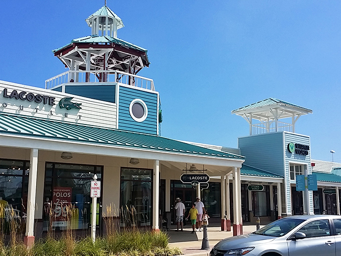Lacoste's blue lighthouse tower&mdash;where the alligator logo reigns supreme and polo shirts multiply in shopping bags like rabbits with good taste.