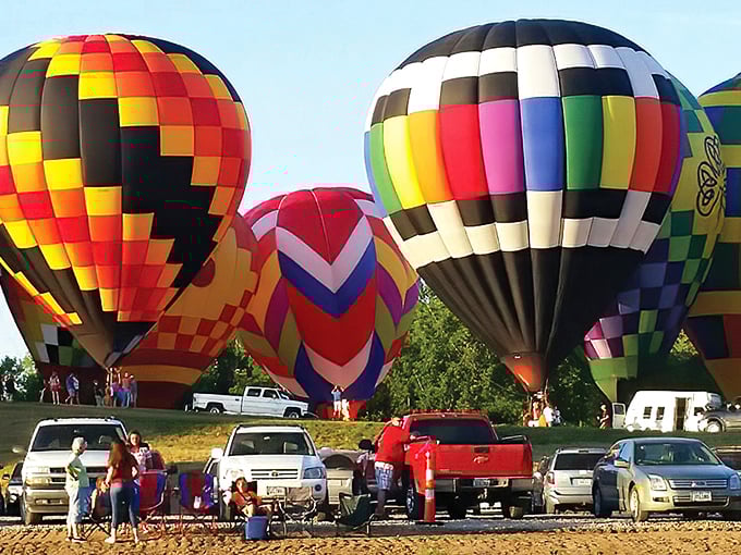 Hot air balloons hovering over Lake Red Rock create a sky canvas that puts ordinary sunsets to shame. Iowa's airspace never looked so festive.