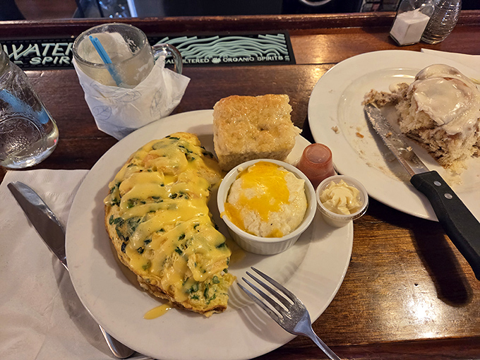 An omelet that clearly went to culinary finishing school. That golden cheese blanket isn't just melted&mdash;it's transformed into breakfast couture.