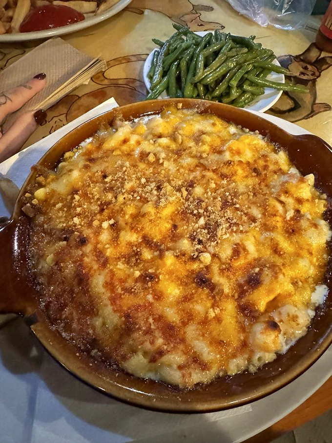 Lobster mac and cheese that bubbles with promises – where comfort food meets luxury in a beautiful, golden-topped romance.