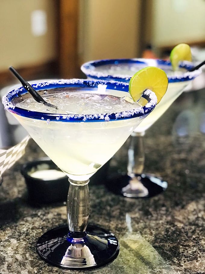 Margaritas with salt-crusted rims and lime wedges&mdash;the universal signal that your worries should take the afternoon off.