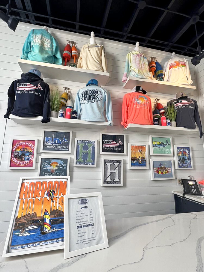The merch wall proves you're not just at a restaurant&mdash;you're at an institution worthy of wearing on a t-shirt.