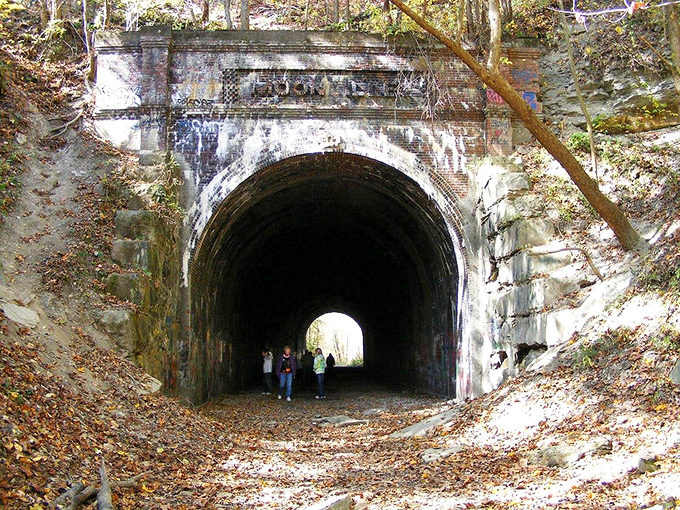 Moonville Tunnel beckons the brave to enter its shadowy passage. Ghost hunters and history buffs share this abandoned railway tunnel with equal enthusiasm.