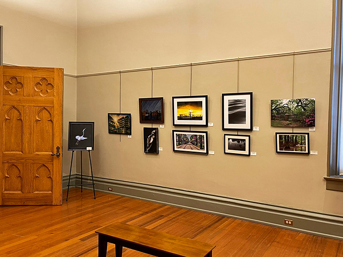 Contemporary art finds a home in these historic halls, where Gothic-arched doorways frame rotating exhibitions against warm wood floors.