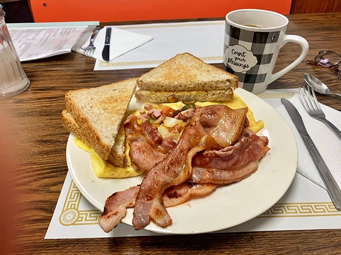 Home fries that dance with colorful peppers while eggs stand guard—a breakfast plate that's both a feast for the eyes and stomach.