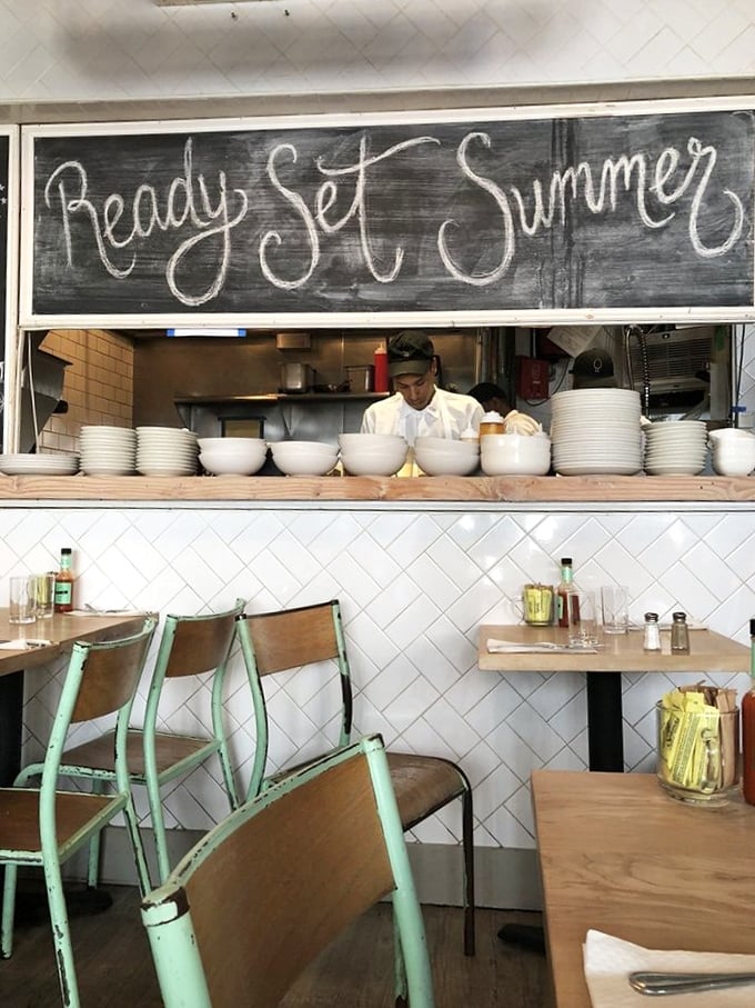"Ready, Set, Summer" says the chalkboard, while stacks of pristine white plates stand at attention, awaiting their egg-topped destiny.
