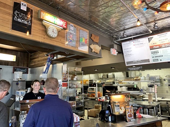 The open kitchen where smoke meets meat. Like watching artists at work, except the masterpieces disappear within minutes of completion.