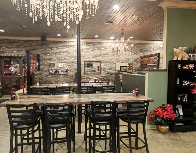 Chandeliers that would make your grandmother's dining room jealous, hanging above tables where barbecue dreams come true. Brilliant contradiction.