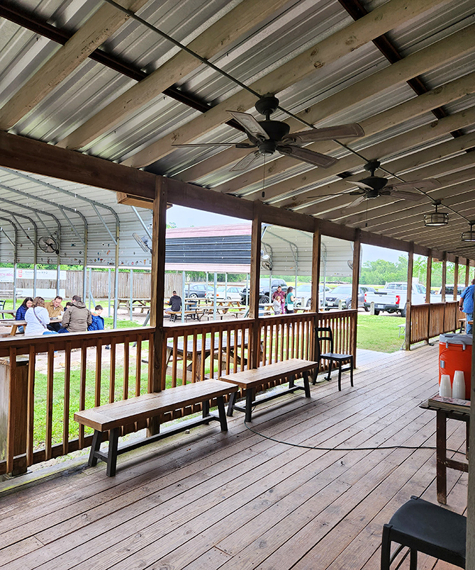 Al fresco feasting under Texas skies. The covered porch offers the perfect setting for contemplating the mysteries of perfect barbecue with fellow believers.