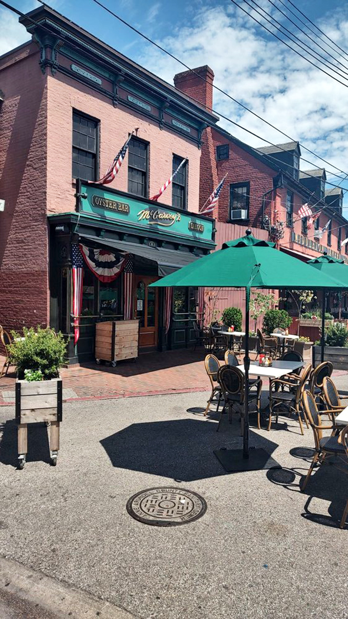 The outdoor seating area transforms ordinary meals into special occasions, with patriotic bunting that reminds you you're dining in America's sailing capital.