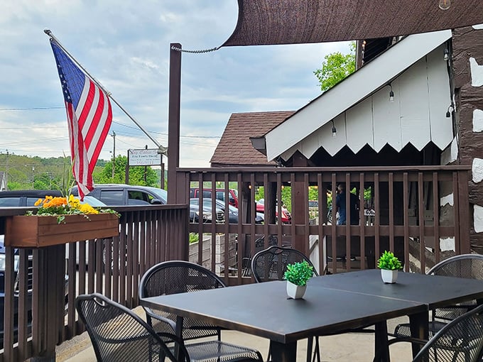 Outdoor seating with American flag proudly displayed&mdash;because somehow food tastes better with a side of fresh air and patriotism. 