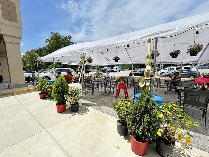 Outdoor seating that says "yes, breakfast can be an al fresco affair." The tent and potted plants create a garden party vibe for your morning feast.