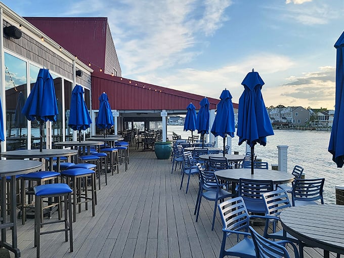 Outdoor dining with that million-dollar bay view. Those blue umbrellas aren't just for shade; they're framing perfect vacation memories.