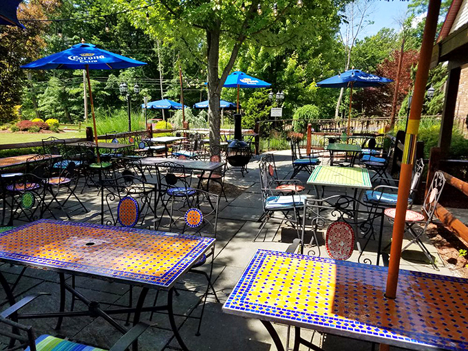The patio's colorful mosaic tables create the perfect outdoor oasis for enjoying those "too good to be true" summer evenings.