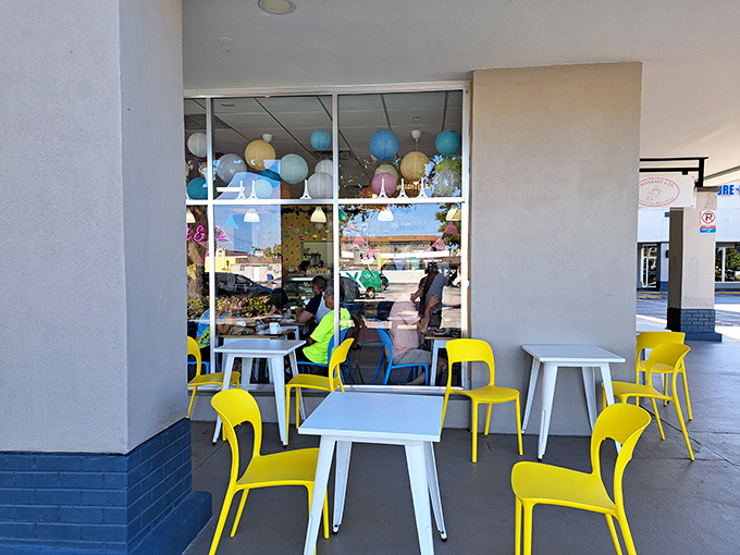 Sunshine-yellow chairs create an outdoor oasis where you can pretend you're on the French Riviera instead of just playing hooky from work.