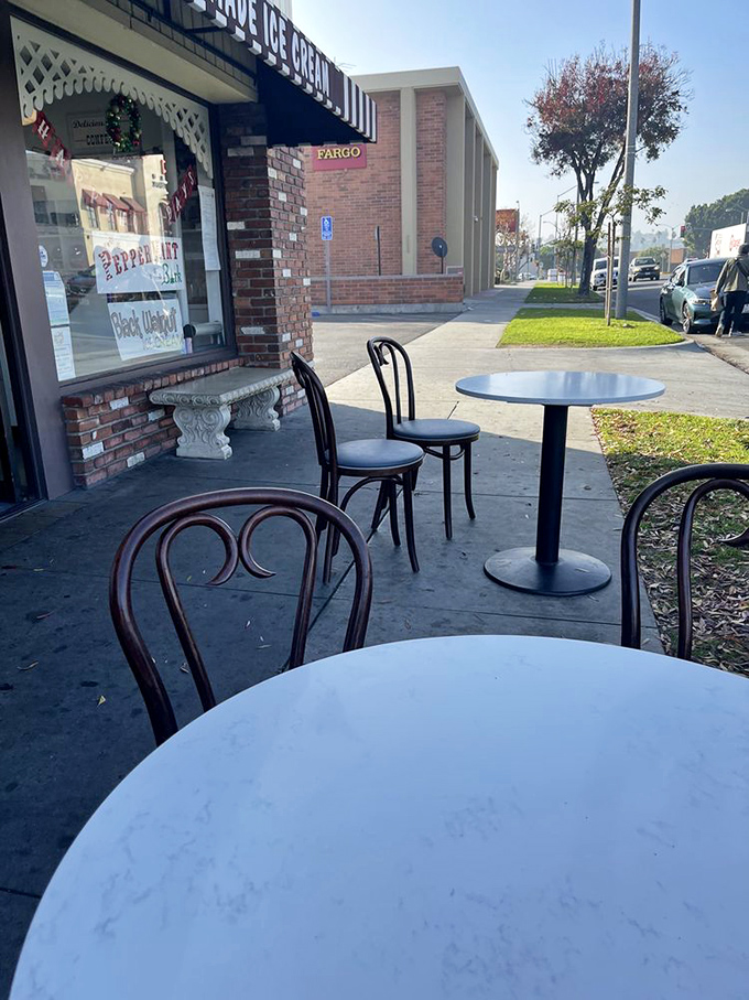 The sidewalk seating area offers the perfect spot to enjoy your frozen masterpiece while judging other people's flavor choices.