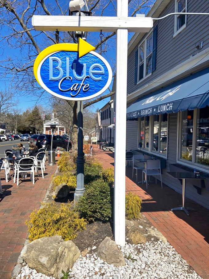The iconic Blue Cafe sign stands as a beacon of breakfast hope on Basking Ridge's charming brick-lined sidewalk.