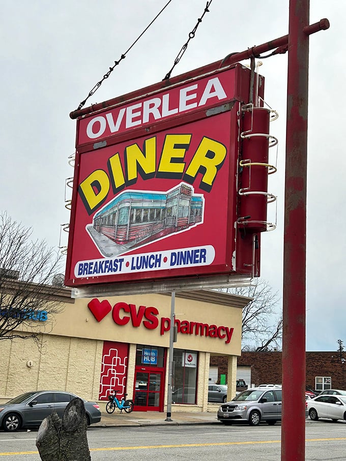 The sign stands as a beacon of hope for hungry travelers, promising three square meals and a respite from chain restaurant monotony.