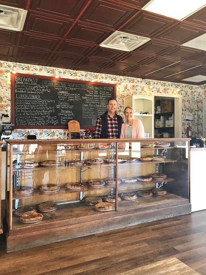 The proud owners stand behind their pie fortress, guardians of family recipes that have made countless Missourians smile over the years.