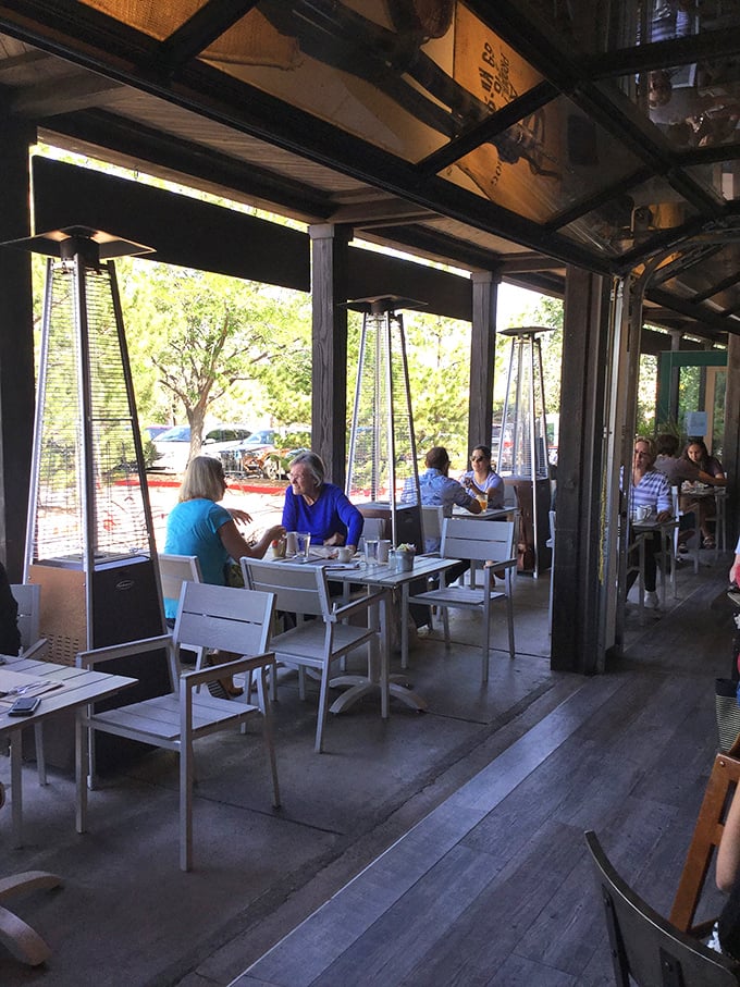 Outdoor dining with heat lamps for those rare chilly Santa Fe mornings, because croissants taste better with a side of sunshine.