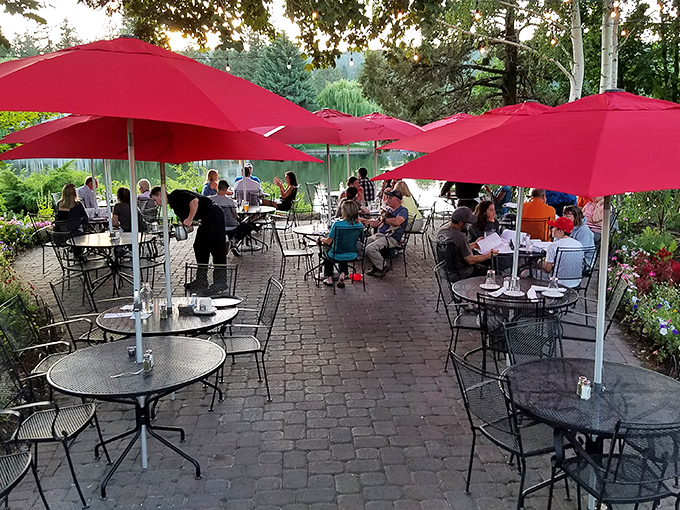 Summer evenings under crimson umbrellas on the patio offer river views and gentle breezes that make dessert seem like a mandatory decision.
