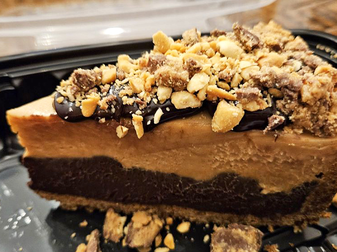 The dessert that answers the eternal question: "Why choose between chocolate and peanut butter when you can have both in towering slice form?"
