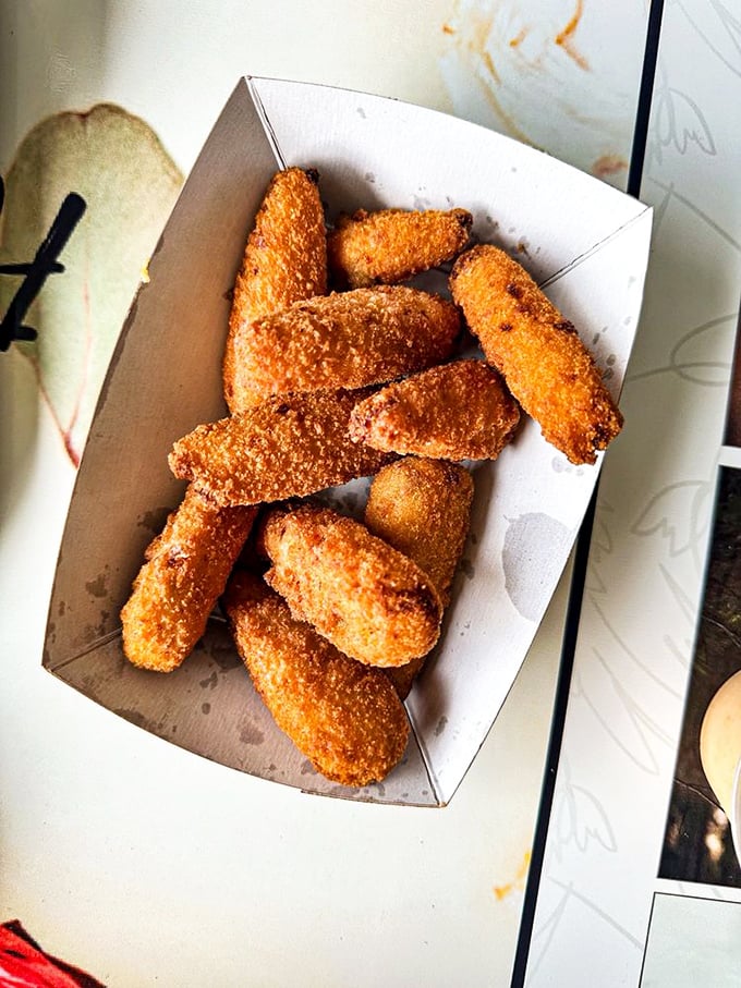 These golden-fried poppers aren't just appetizers&mdash;they're little capsules of joy that make waiting for your burger almost bearable.