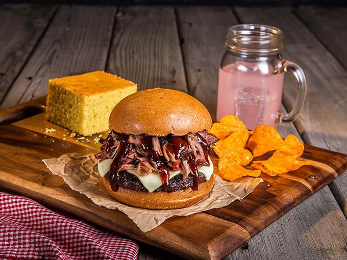 The pulled pork burger doesn't just blur the line between sandwich categories&mdash;it obliterates it. That cornbread square is the supporting actor who steals the show.