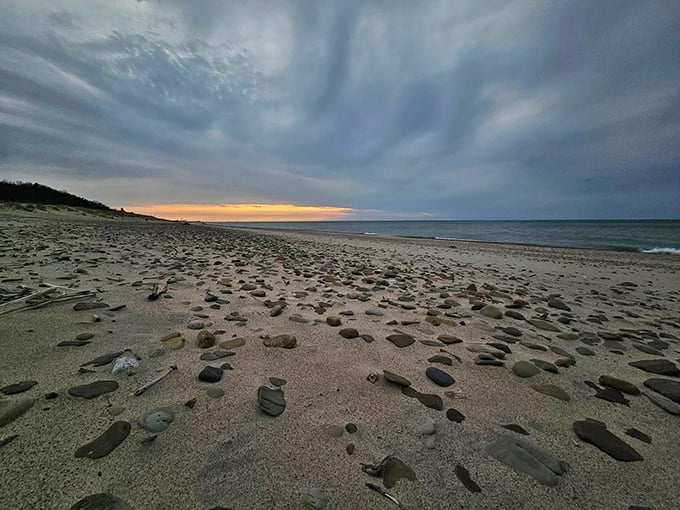 Stones scattered like nature's confetti along the shore. Each visit to Kemil Beach reveals a new collection of smooth rocks polished by centuries of gentle waves.