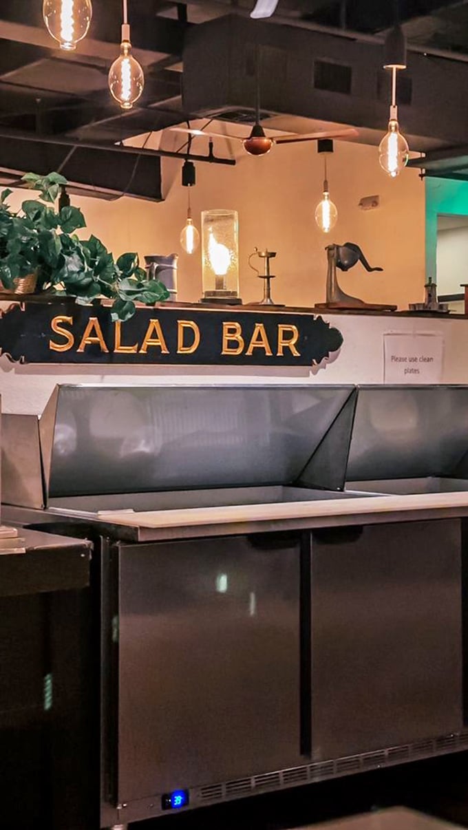 The salad bar sign illuminated like Broadway marquee&mdash;because in the world of steakhouses, a good salad bar deserves its own spotlight.