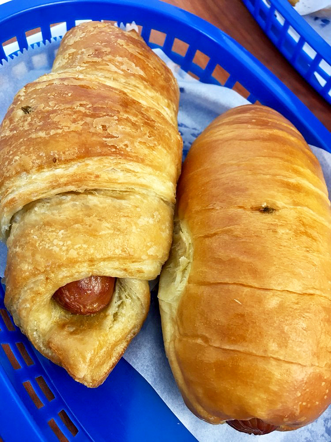 Flaky, buttery croissants with peeking sausages represent the savory side of Instant Donuts, perfect for those who prefer their breakfast on the heartier side.