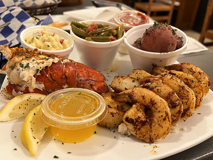 A plate that proves land and sea can coexist beautifully. That lobster tail and those grilled shrimp are having the reunion tour we all needed.