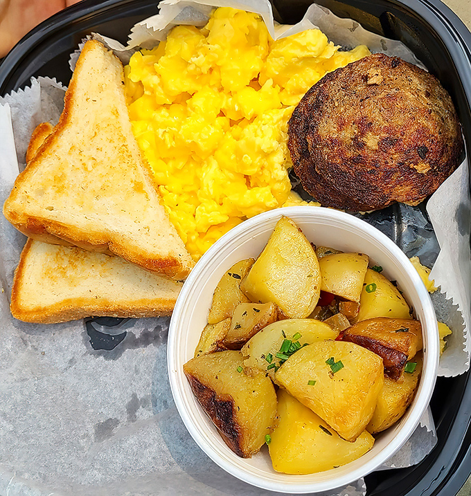 The Southern Breakfast platter: toast, potatoes, eggs, and a biscuit. The kind of fortification pioneers must have dreamed about crossing the Appalachians.