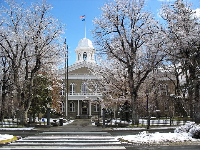 The Nevada State Capitol building stands majestically against a winter backdrop, its dome a beacon of Silver State history since 1871.