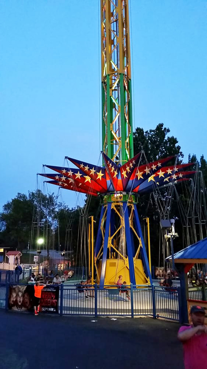 The American-themed SkyScreamer lights up the evening sky, spinning riders high enough to reconsider life choices.