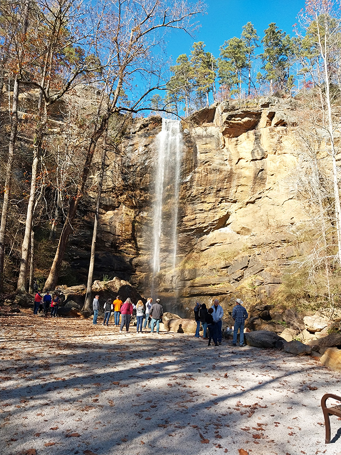 Fall crowds gather like concert-goers at nature's amphitheater, patiently waiting for their chance to snap the perfect waterfall selfie.