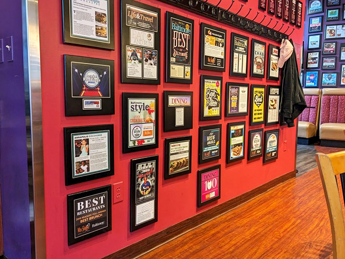The wall of fame isn't bragging&mdash;it's documentation. Each frame tells the story of a restaurant that refuses to be ordinary.