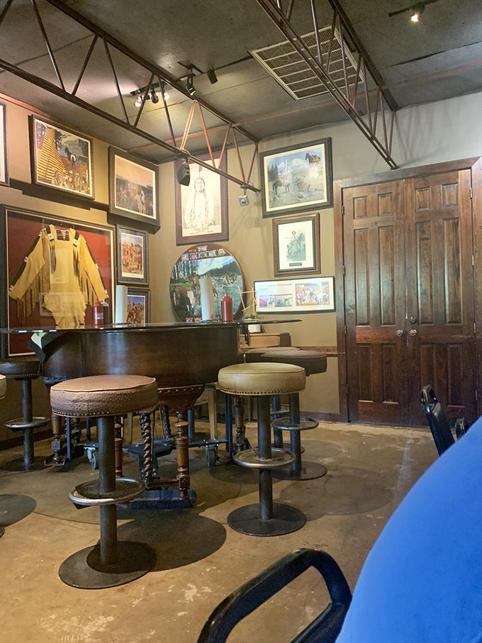 The piano bar corner feels like stepping into a Western saloon with an arts degree. Those bar stools have heard some stories.