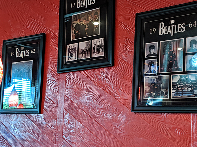 The Beatles memorabilia adorning vibrant red walls creates an atmosphere where you can almost hear "Strawberry Fields Forever" playing softly in the background.
