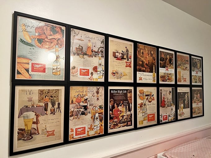 The vintage ad wall isn't just decoration&mdash;it's a time machine serving nostalgia alongside your coffee and grits.