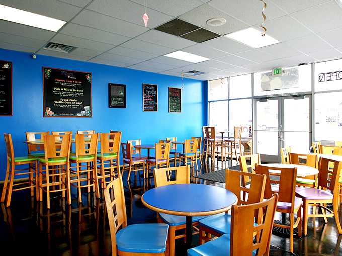 The bright blue walls and pendant lighting create an atmosphere that's part underwater fantasy, part sugar-fueled happiness factory. 