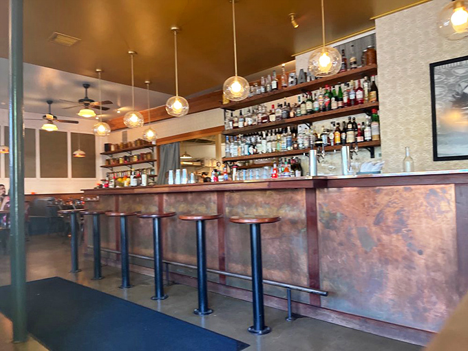 The copper-fronted bar isn't just functional&mdash;it's the starting line for brunch cocktails that deserve their own fan club.