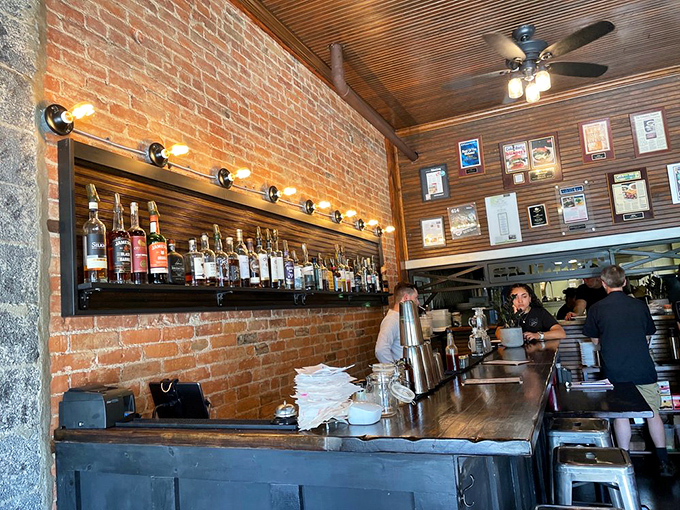 The bar area showcases both craftsmanship and craft spirits, with warm lighting that makes even morning feel cozy.