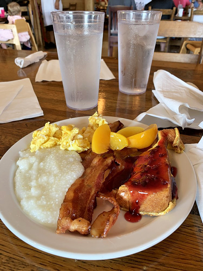 A breakfast sampler that covers all the bases&mdash;grits, eggs, bacon, and fruit. It's like the all-star team of morning foods.