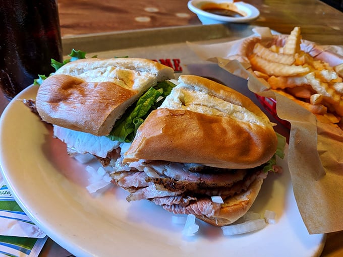 A sandwich so good it requires both hands and your full attention. Notice how nobody's talking? That's barbecue respect.
