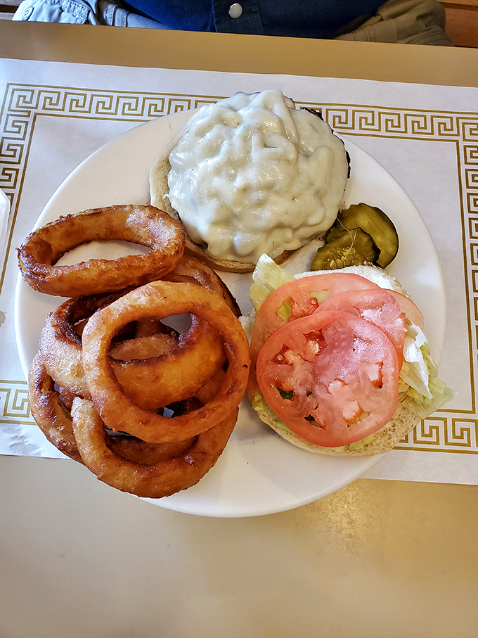 Two sunny-side up eggs keeping watch over a crispy hash that's been browned to perfection. Breakfast doesn't get more honest than this.