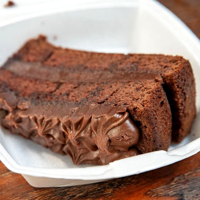 Chocolate cake so rich it should come with its own tax bracket. The kind of dessert that makes you reconsider the concept of "too much."